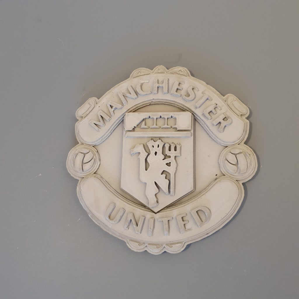 Manchester United Concrete Badge – COApps